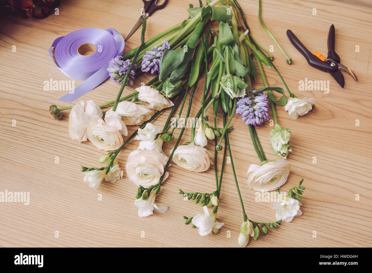 Florist workplace: flowers and accessories Stock Photo - Alamy