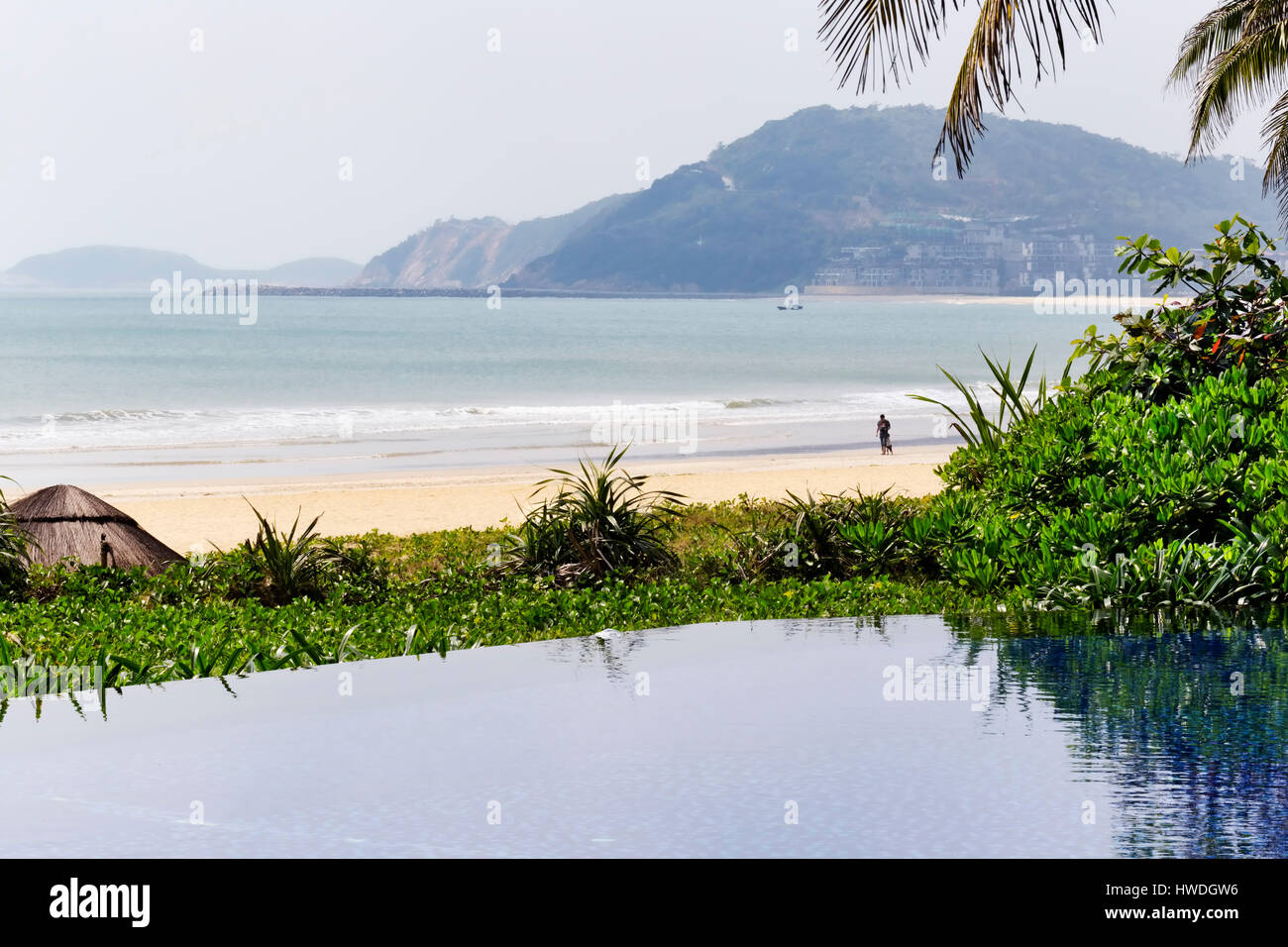 View of a tropical beach and pool in Hainan island - China Stock Photo ...