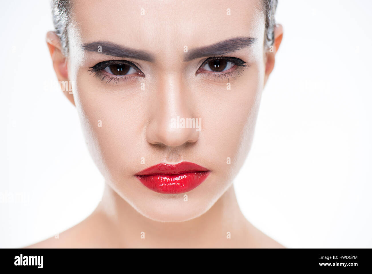 Close up portrait of pretty woman frowning looking at camera Stock ...
