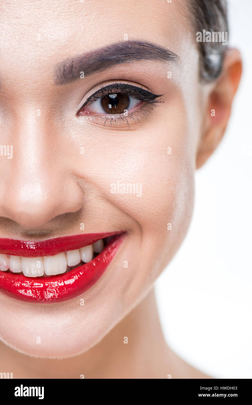 Half of smiling female face with red lips on white Stock Photo - Alamy