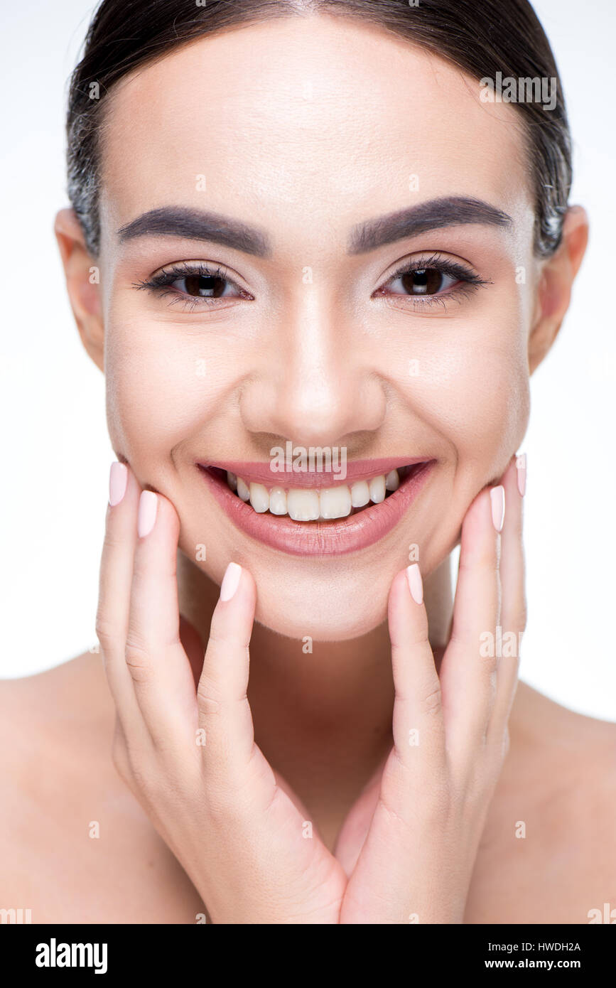 Beautiful woman touching face hi-res stock photography and images - Alamy