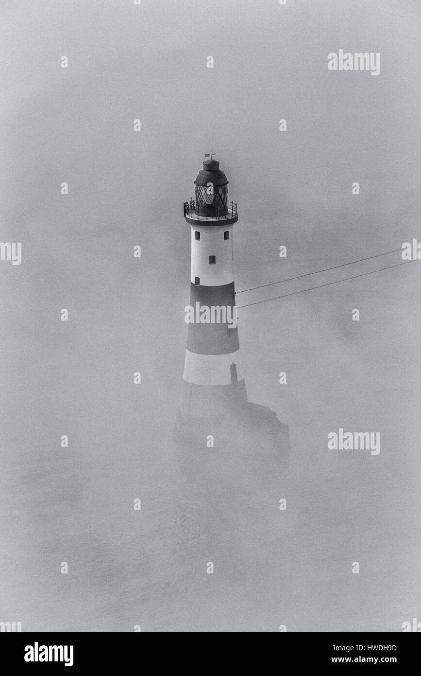 White lighthouse in mist hi-res stock photography and images - Alamy