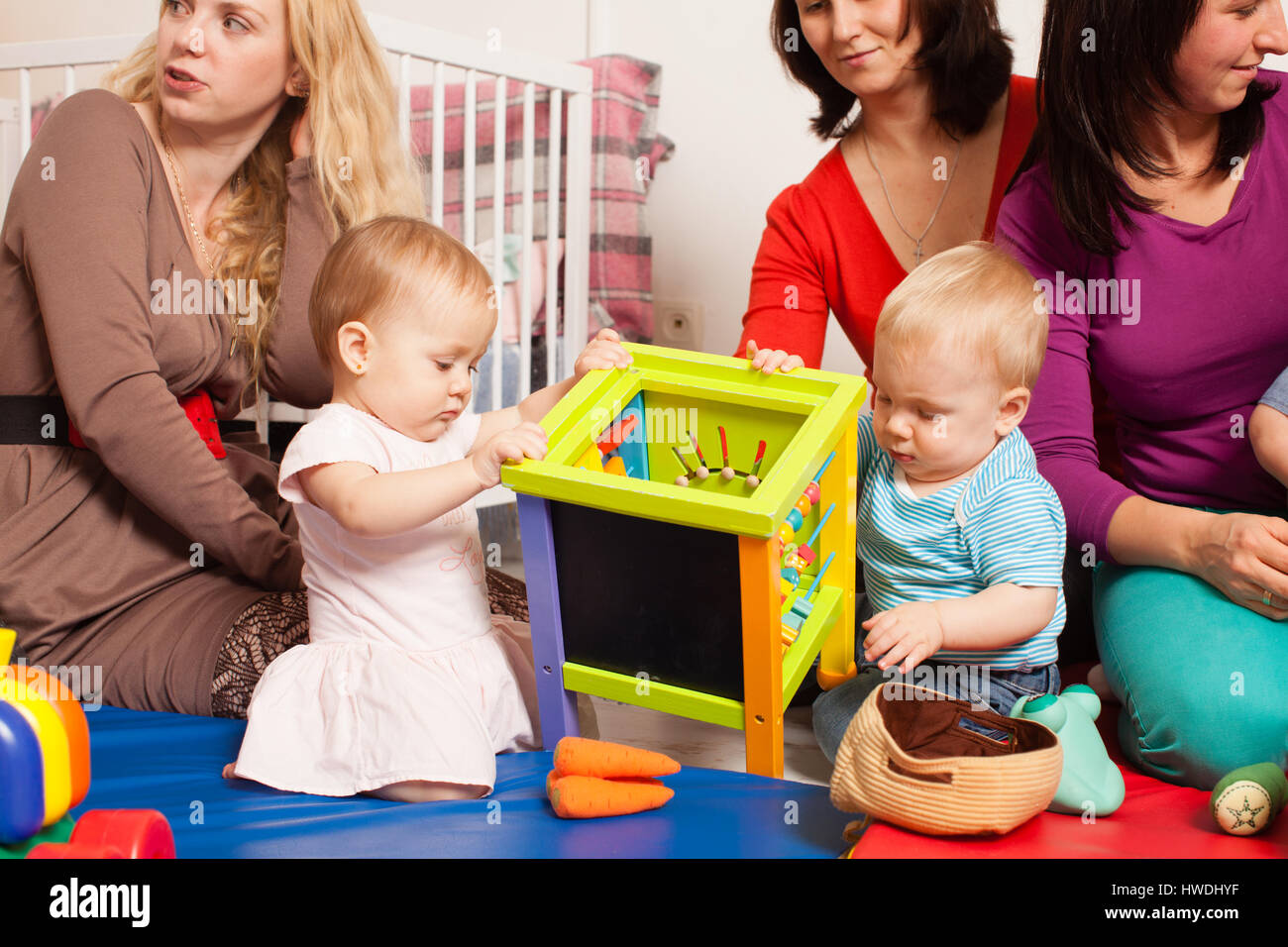 Group of mothers with their babies Stock Photo - Alamy