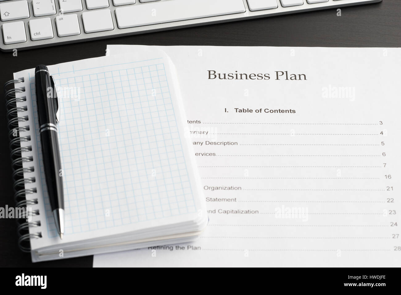 Business plan and pen close-up Stock Photo - Alamy