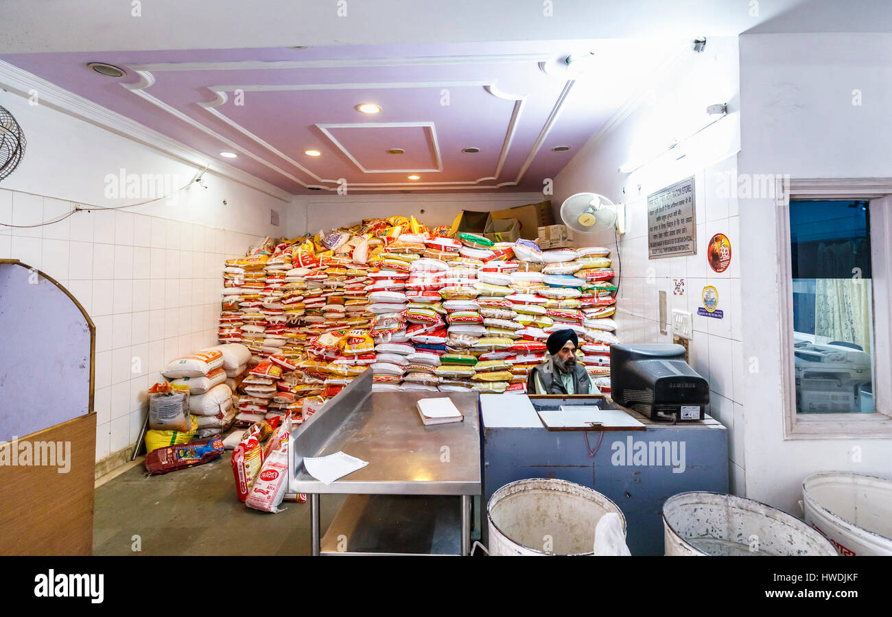 Colourful sacks full of donated food stacked in the ration store ...