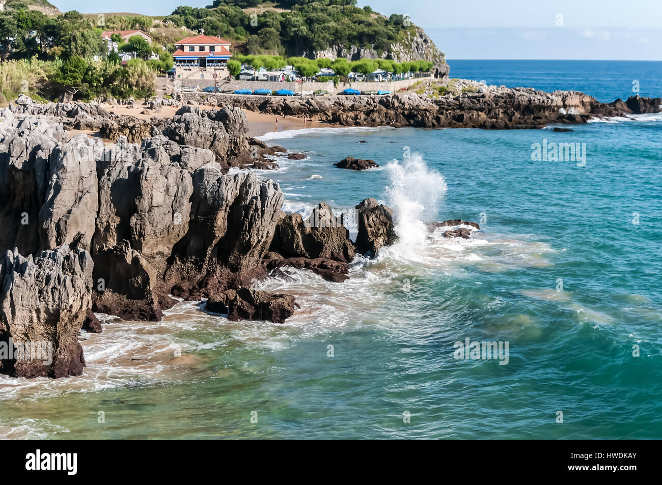 Waves Splashing Against Rocks Stock Photo - Alamy