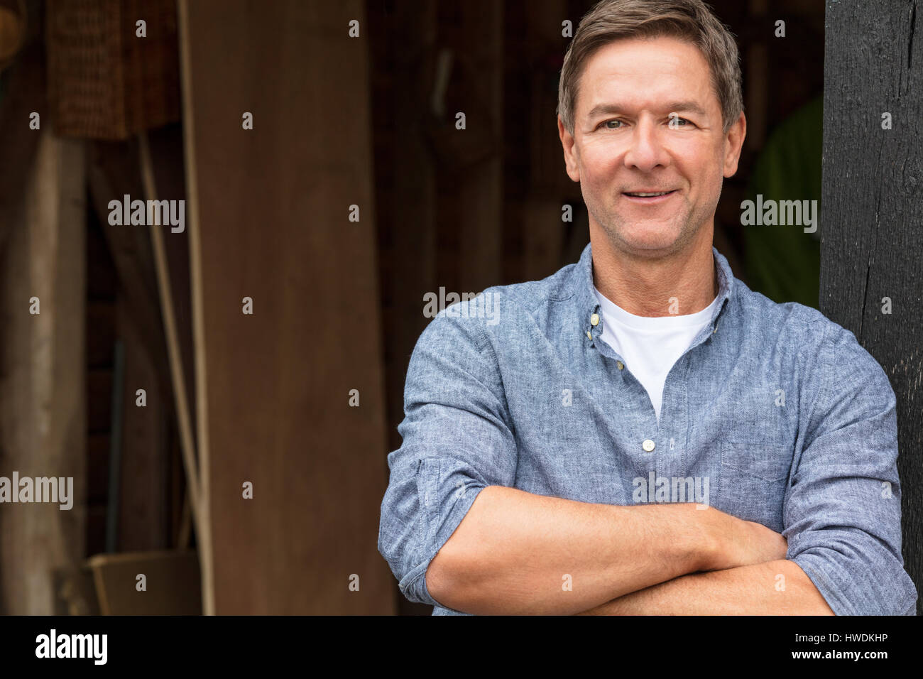 Portrait shot of an attractive, successful and happy middle aged man ...