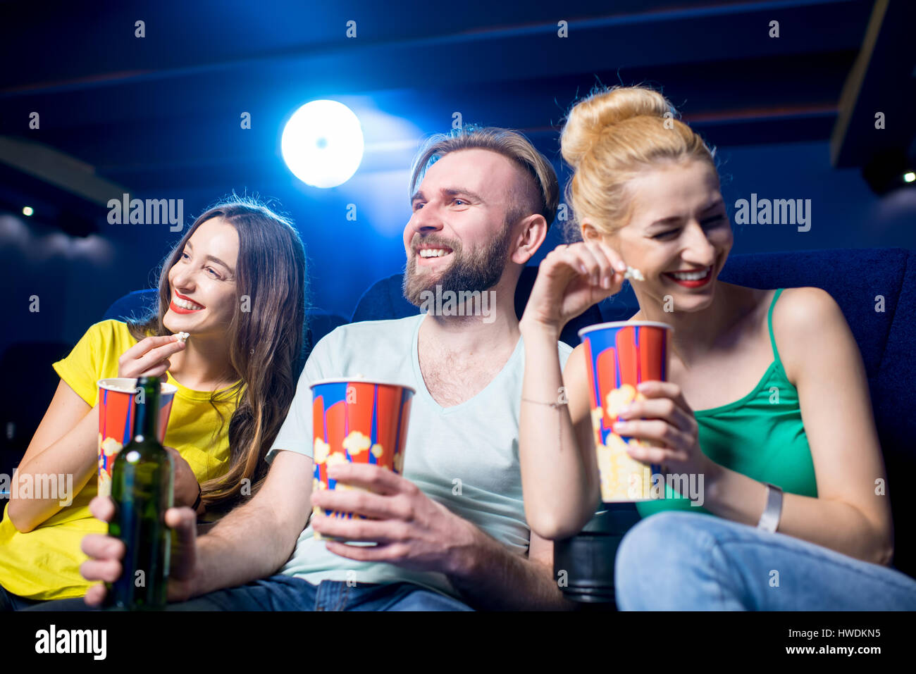 Friends in the cinema Stock Photo - Alamy