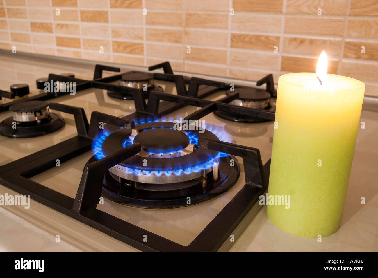 Closeup shot of blue fire from domestic kitchen stove. Gas cooker with ...