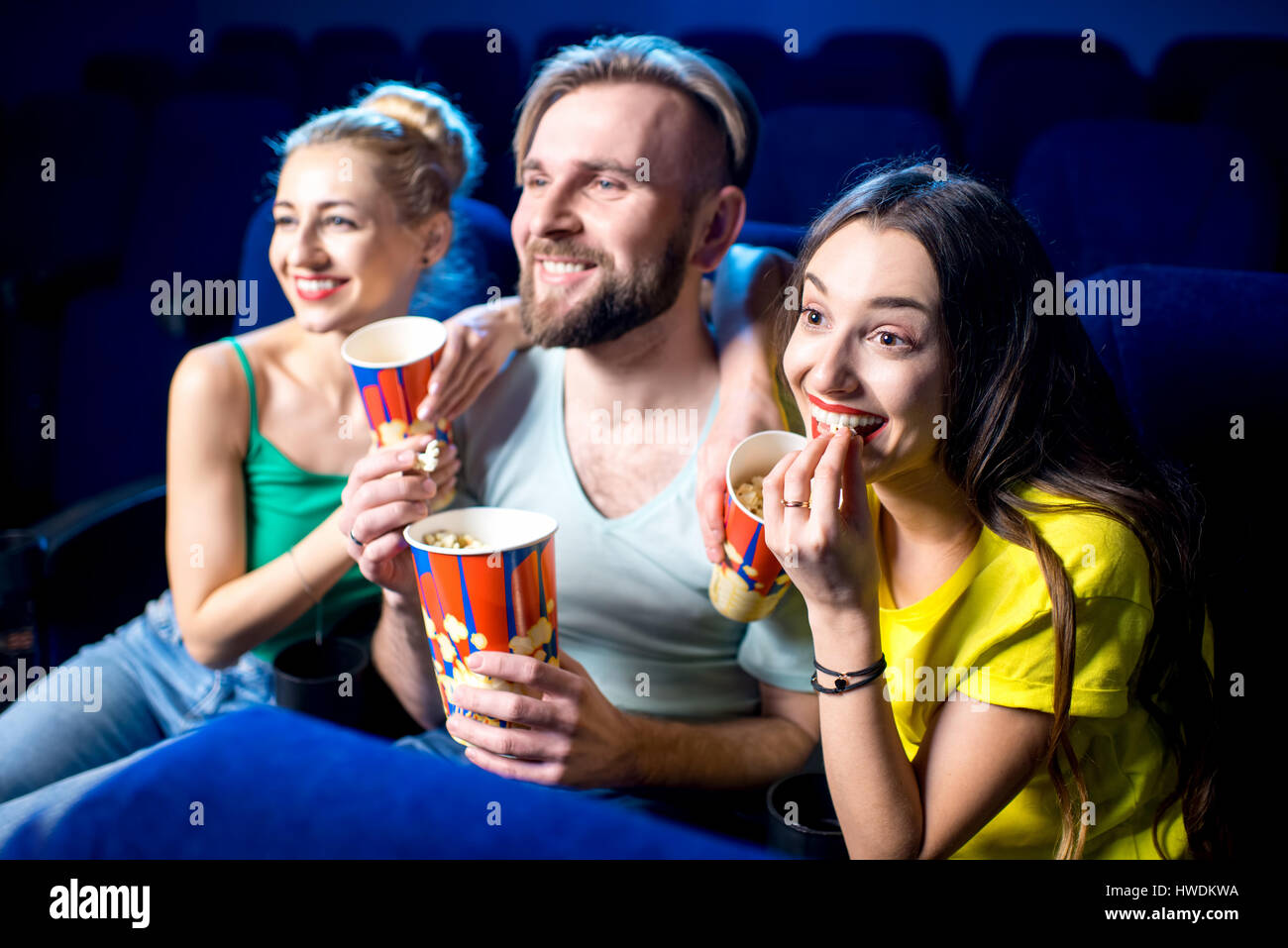 Friends in the cinema Stock Photo - Alamy