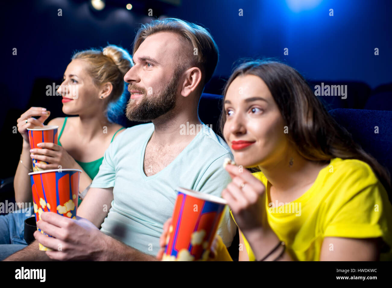 Friends in the cinema Stock Photo - Alamy