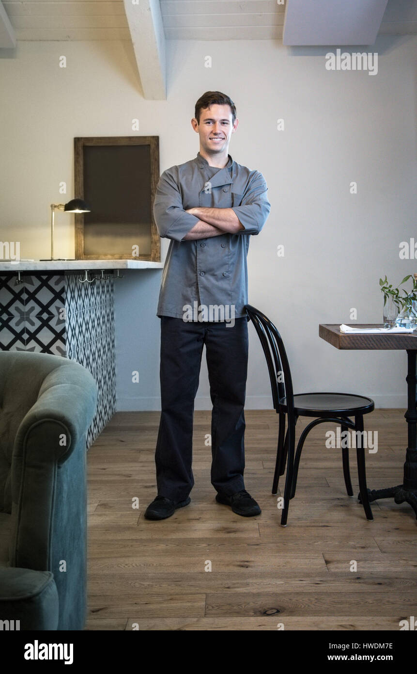 Portrait of waiter in restaurant Stock Photo - Alamy