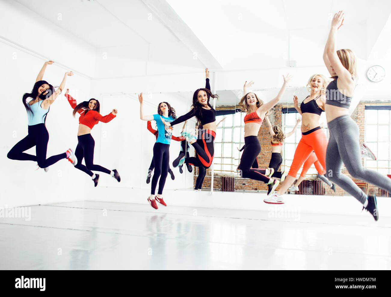 Women doing sport in gym, jumping, healthcare lifestyle people concept ...