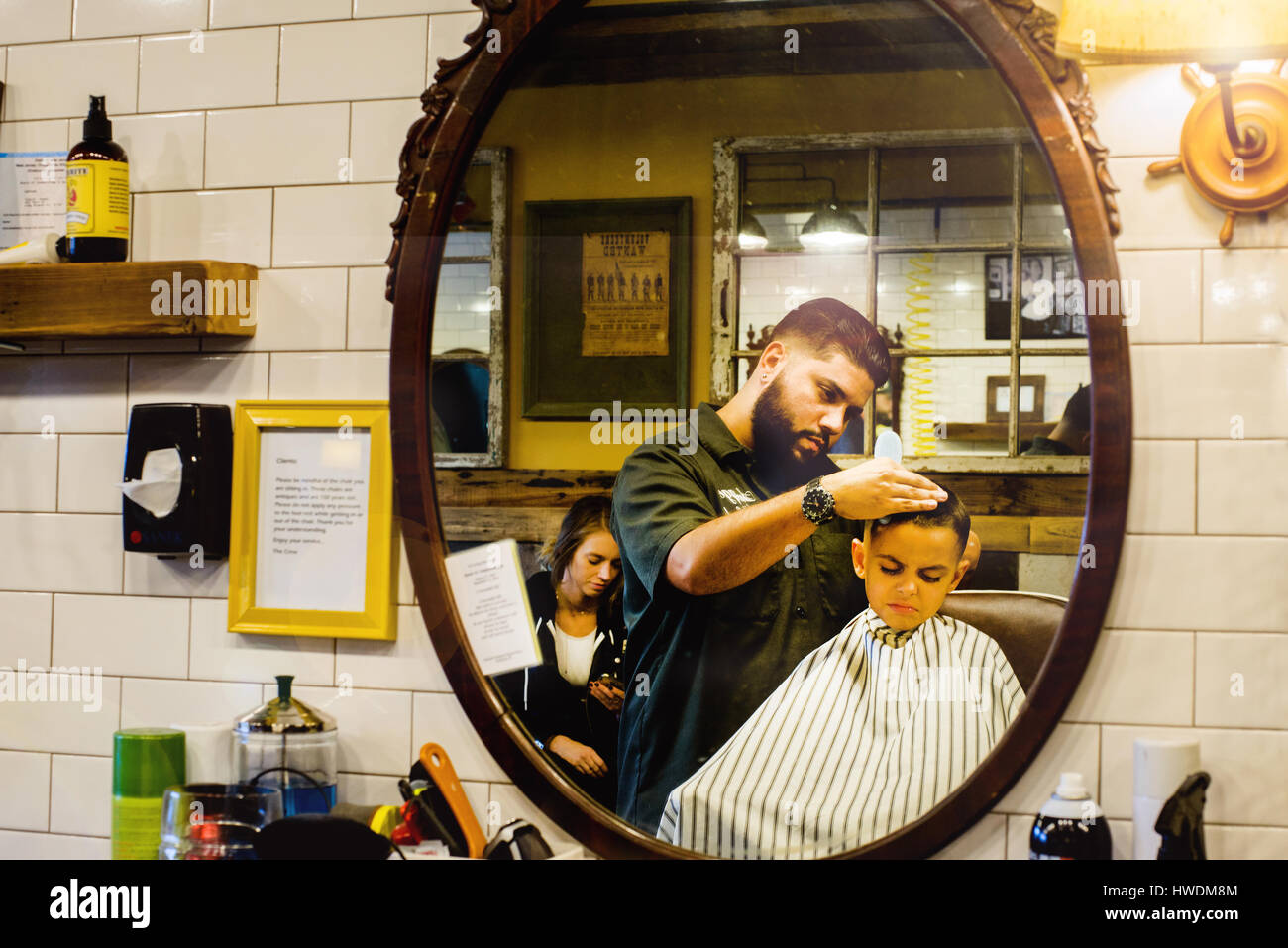 Barber shaving boy's hair Stock Photo - Alamy