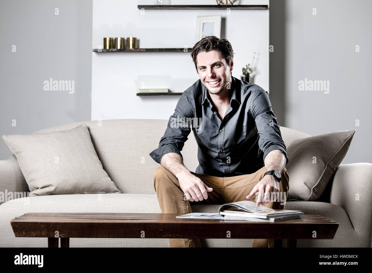 Sofa smiling hi-res stock photography and images - Alamy