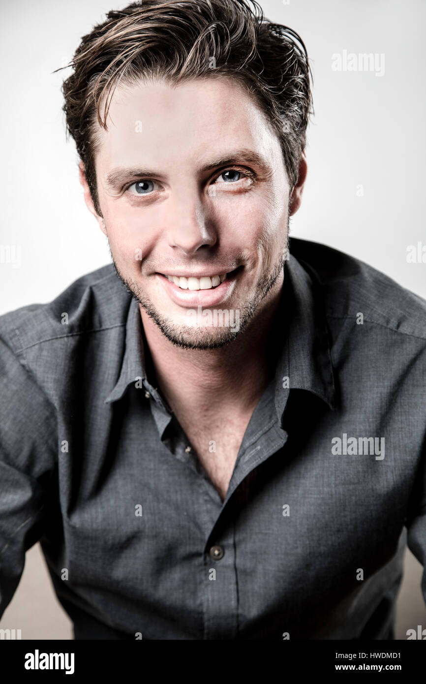 Smiling young man hi-res stock photography and images - Alamy
