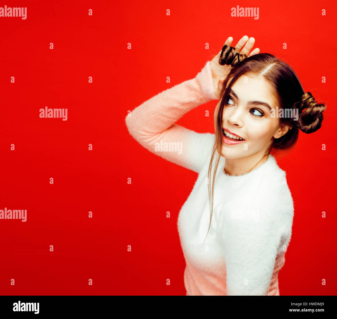 young pretty emitonal posing teenage girl on bright red background ...