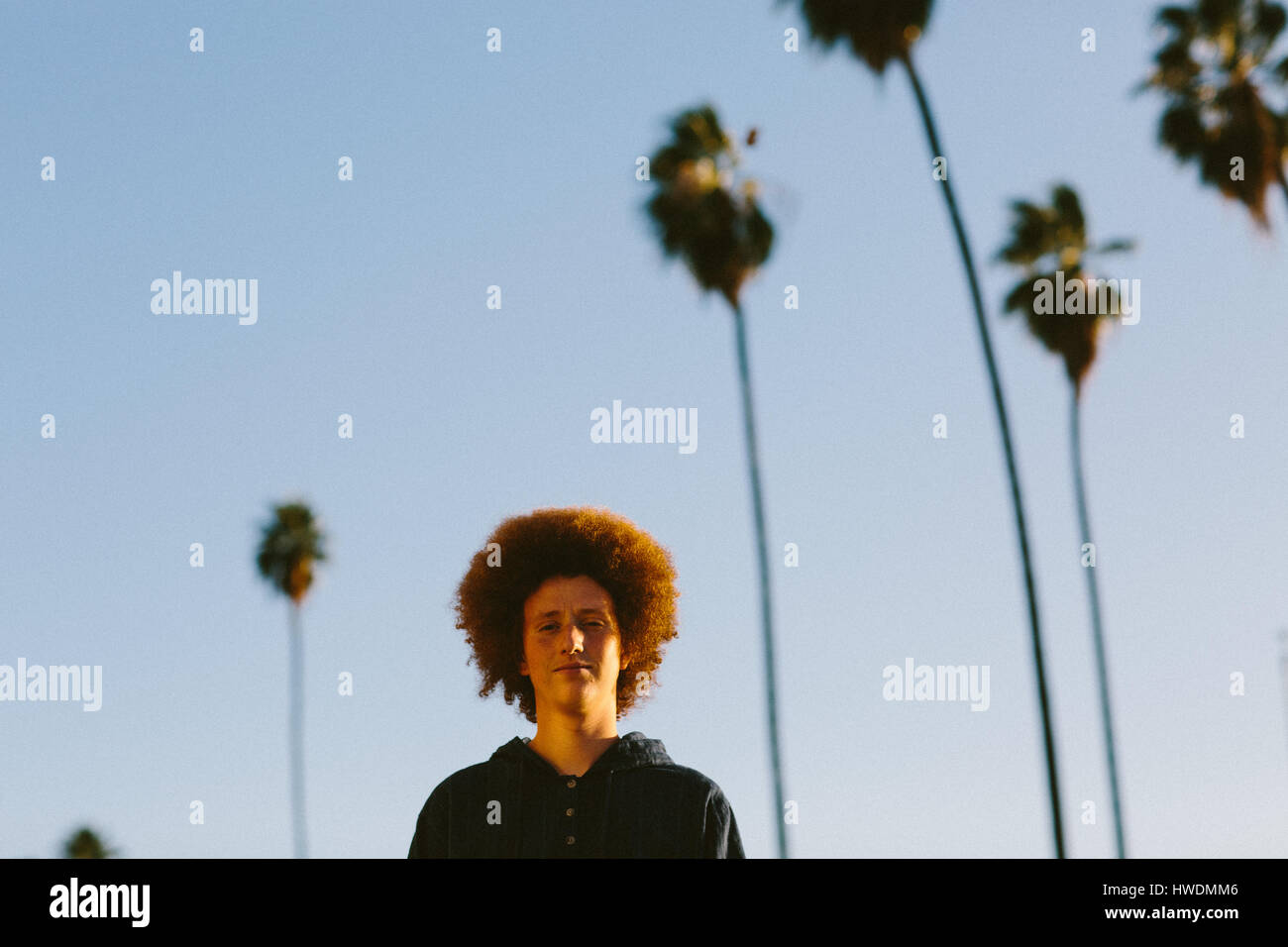 Portrait of teenage boy with red afro hair, outdoors Stock Photo - Alamy