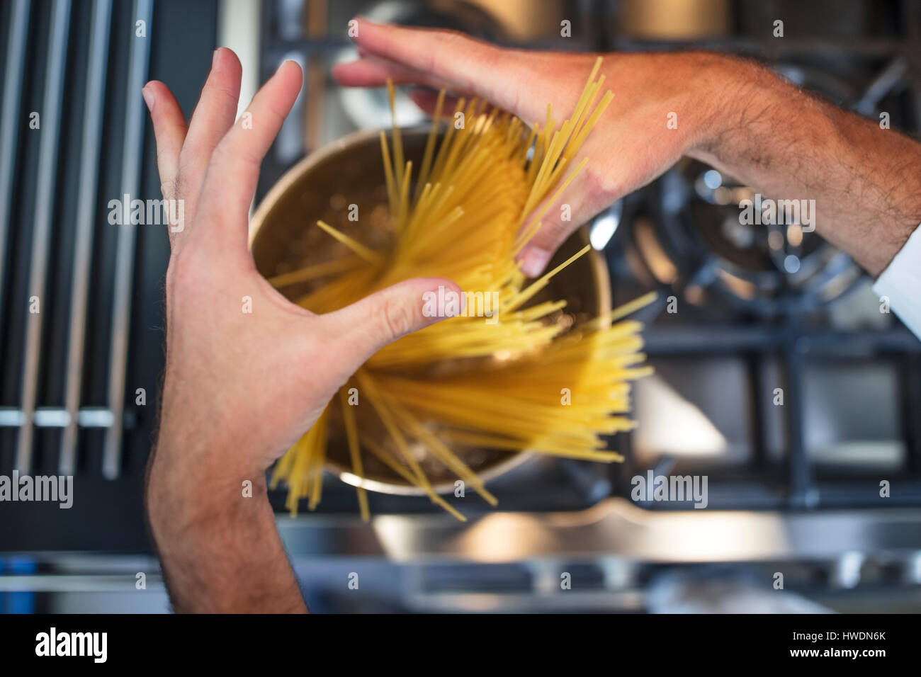 Man young cook cuisine saucepan hi-res stock photography and images - Alamy