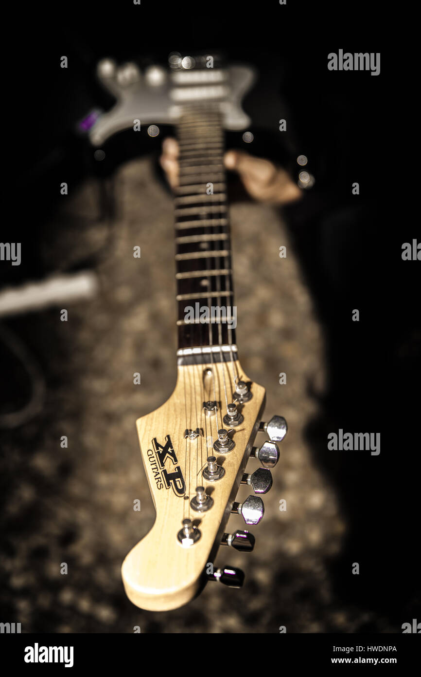 young man playing the electric guitar Stock Photo - Alamy