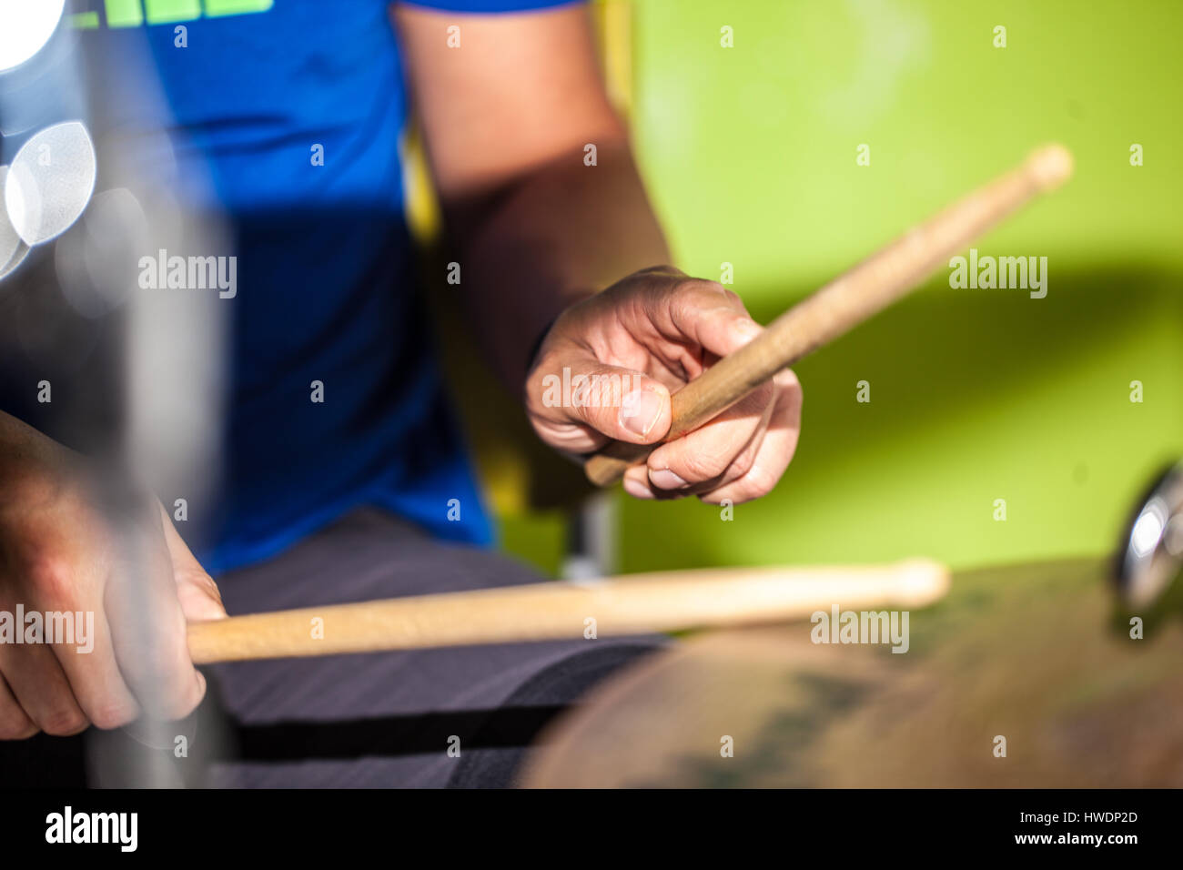 young man playing the drums in a room Stock Photo - Alamy