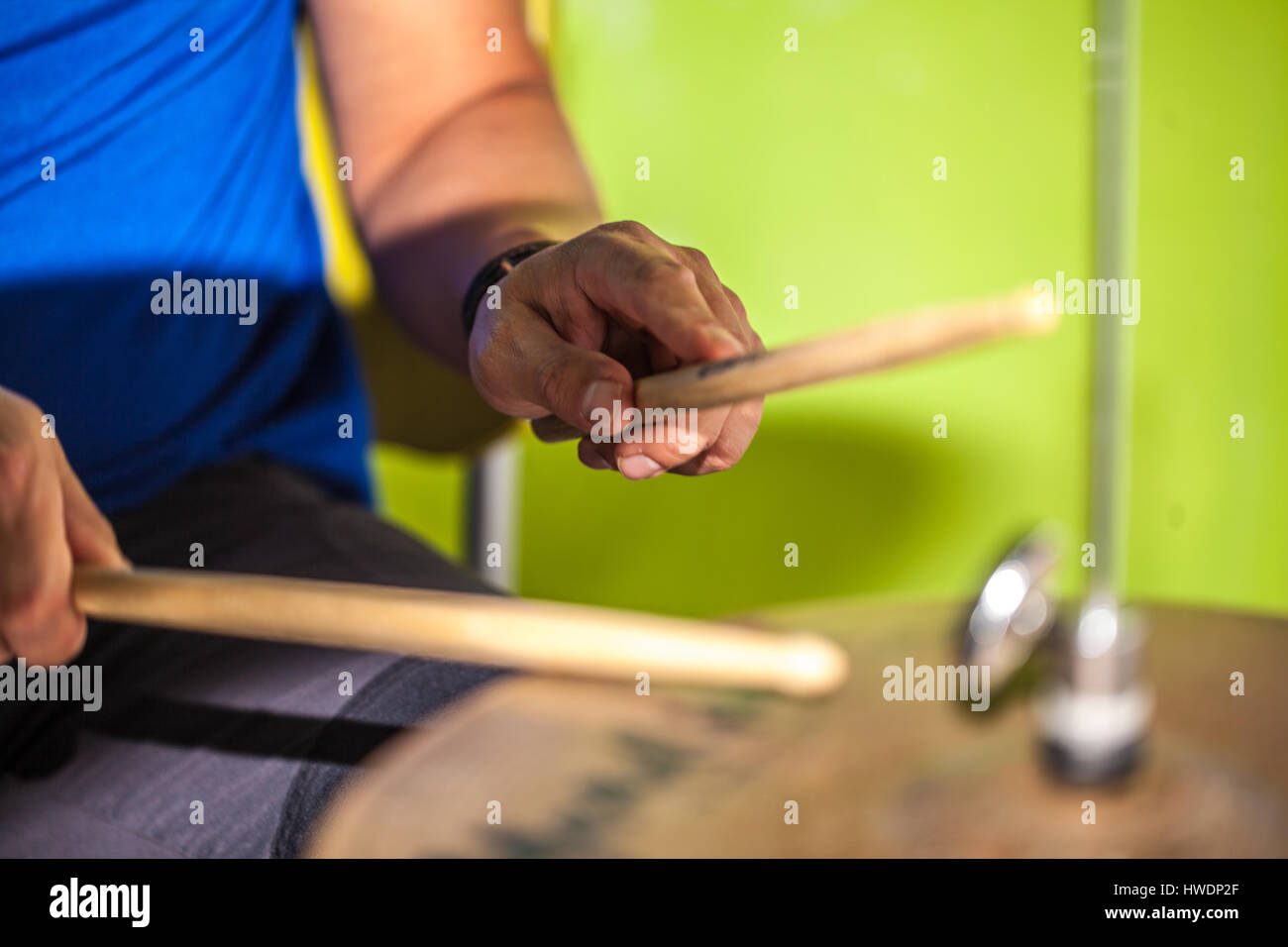 young man playing the drums in a room Stock Photo - Alamy