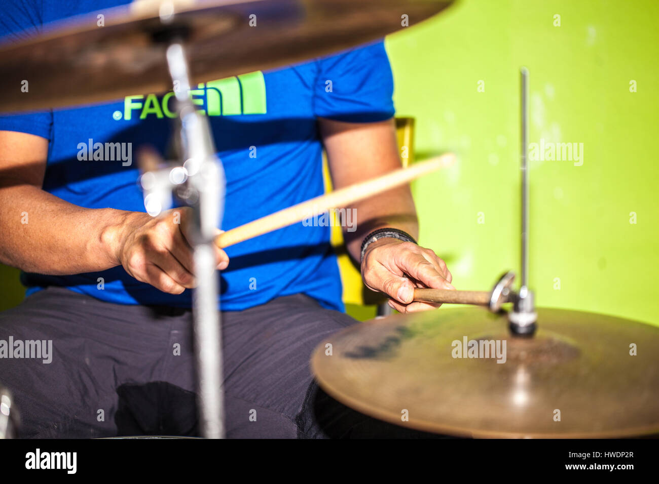 young man playing the drums in a room Stock Photo - Alamy
