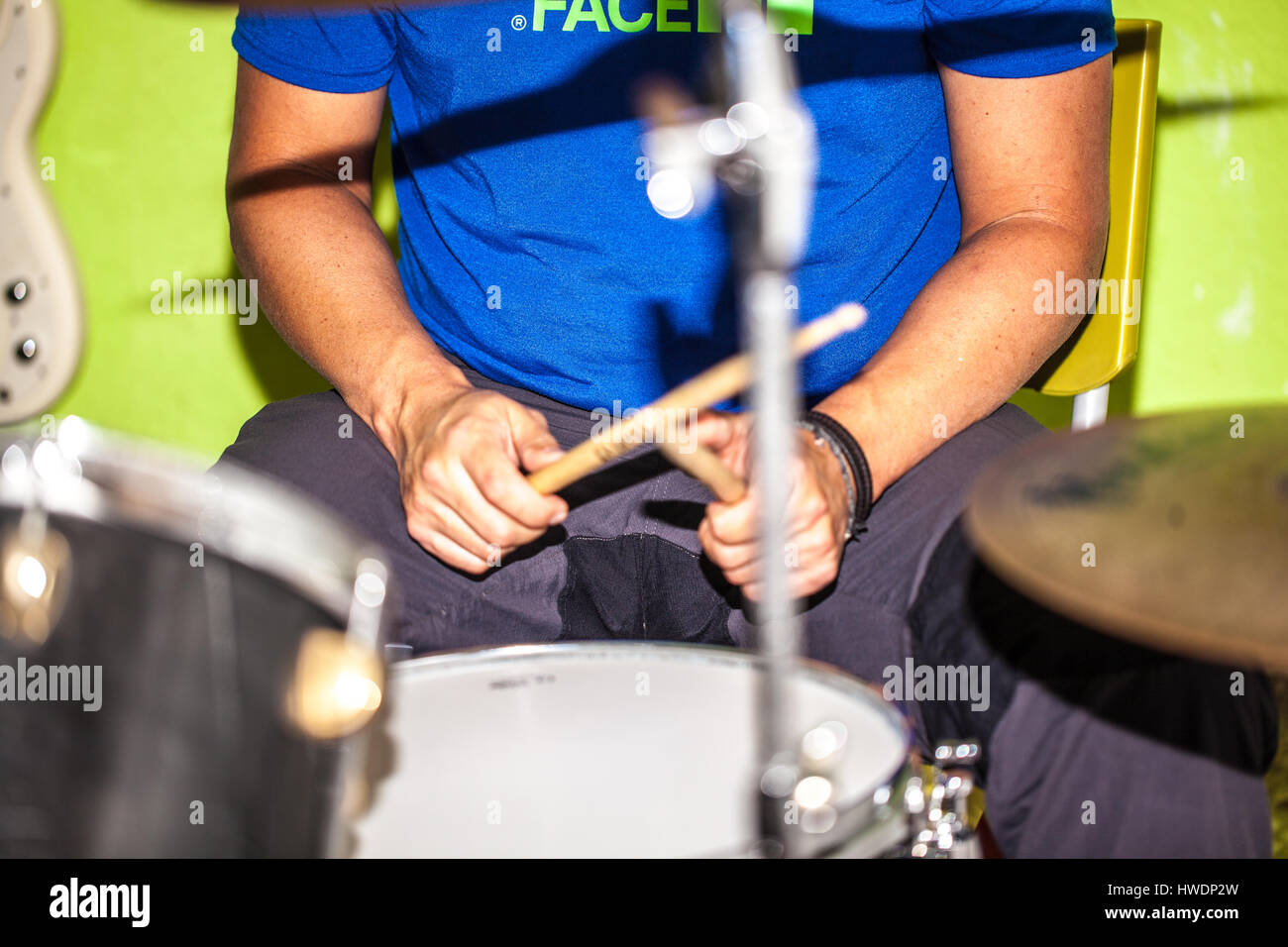 young man playing the drums in a room Stock Photo - Alamy