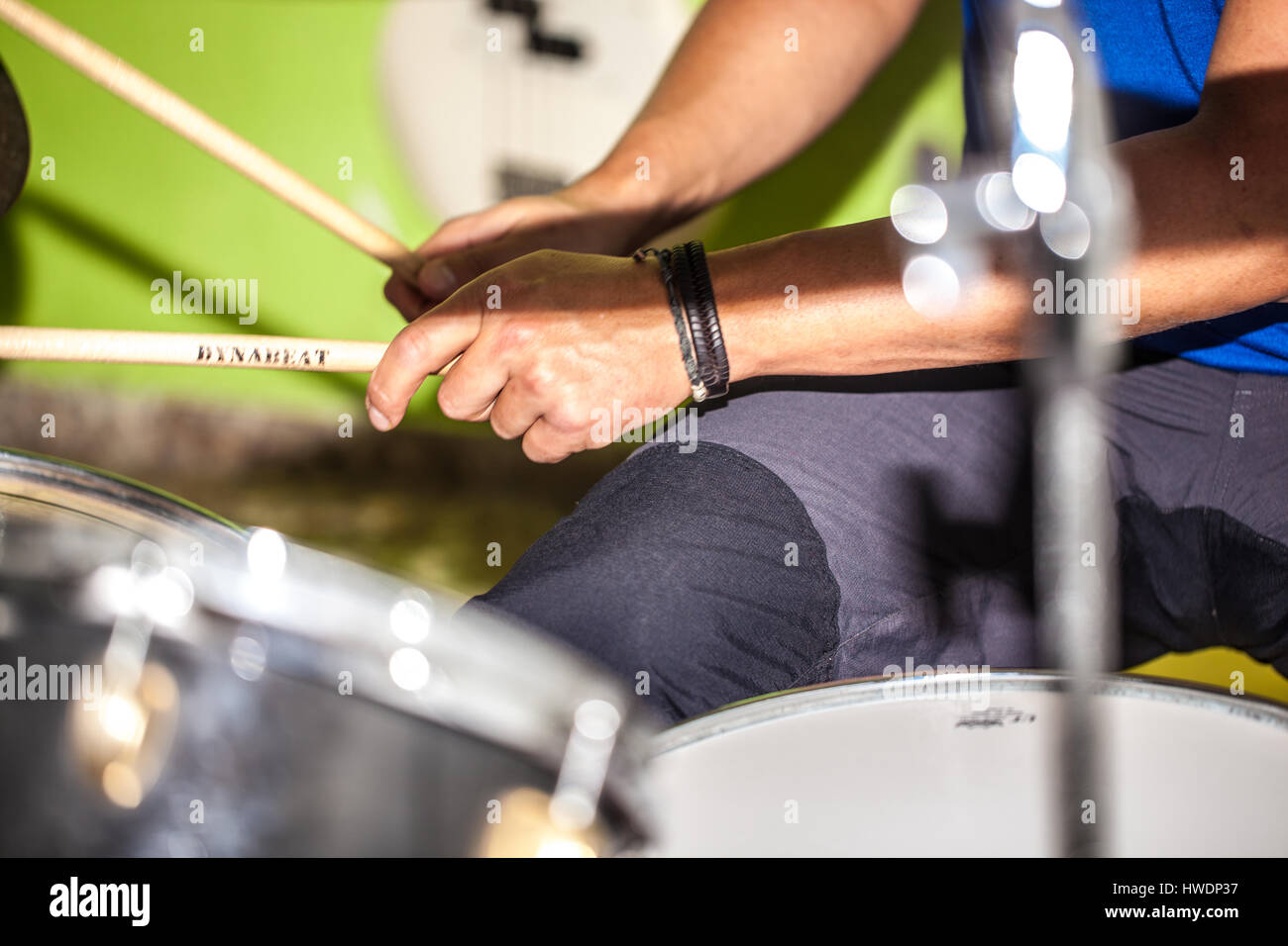 young man playing the drums in a room Stock Photo - Alamy