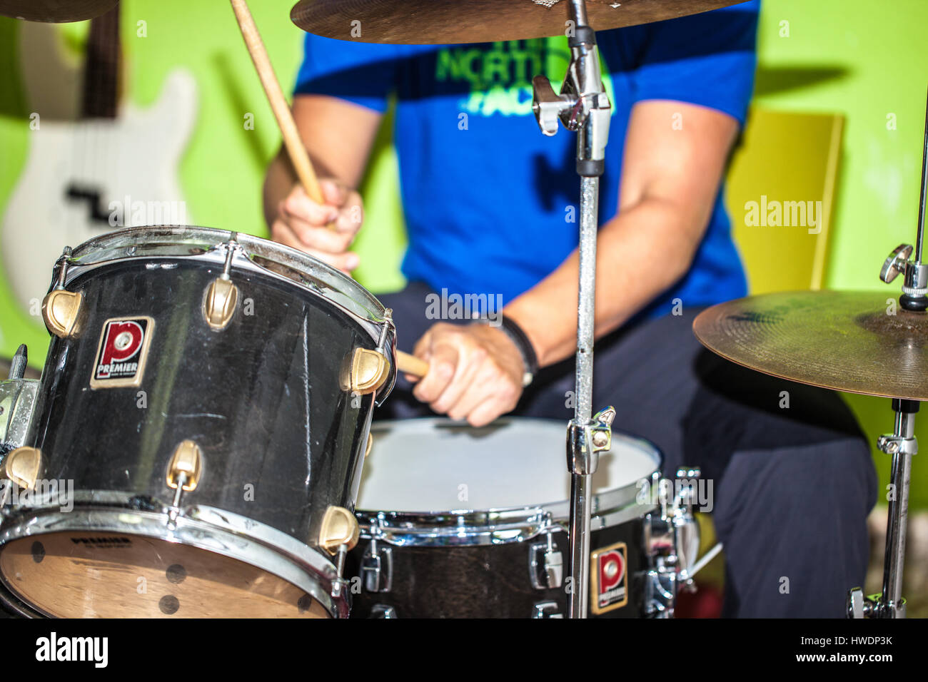 young man playing the drums in a room Stock Photo - Alamy