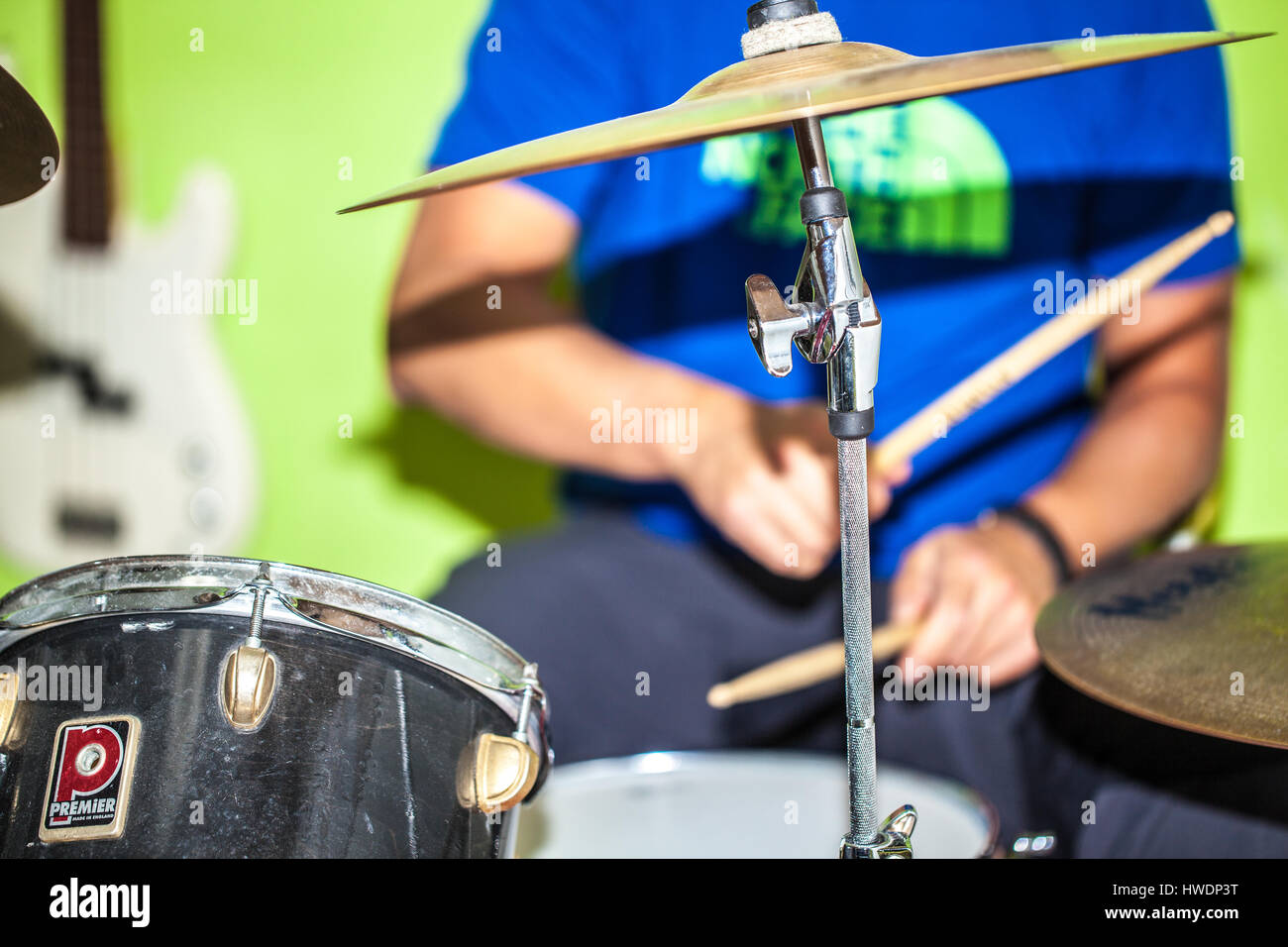 young man playing the drums in a room Stock Photo - Alamy