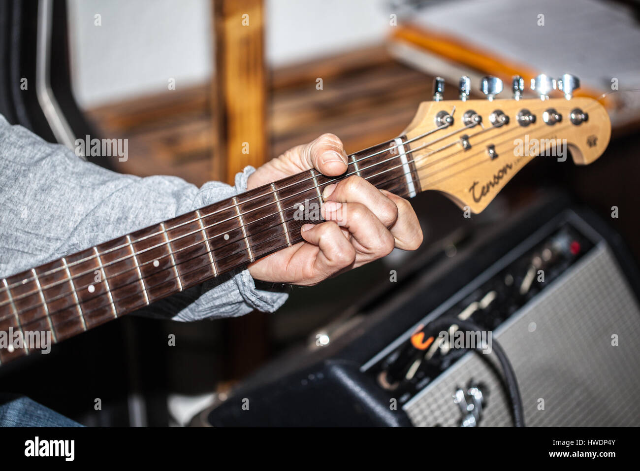 young man playing an electric guitar Stock Photo - Alamy