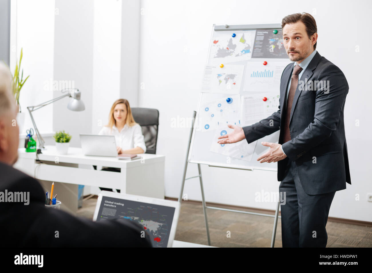 Surprised employee discussing the project in the office Stock Photo - Alamy
