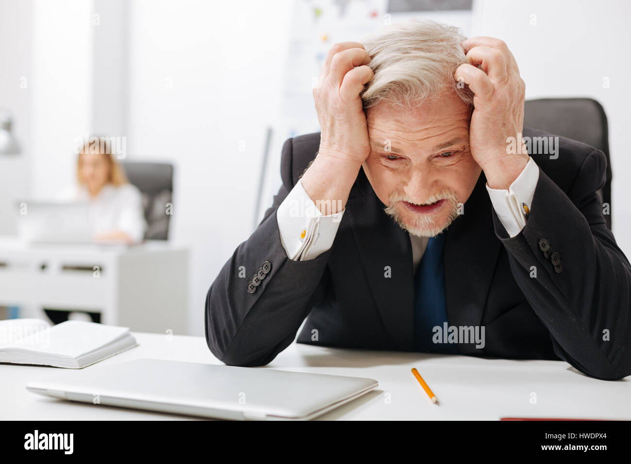 Desperate aged employer expressing anger in the office Stock Photo - Alamy