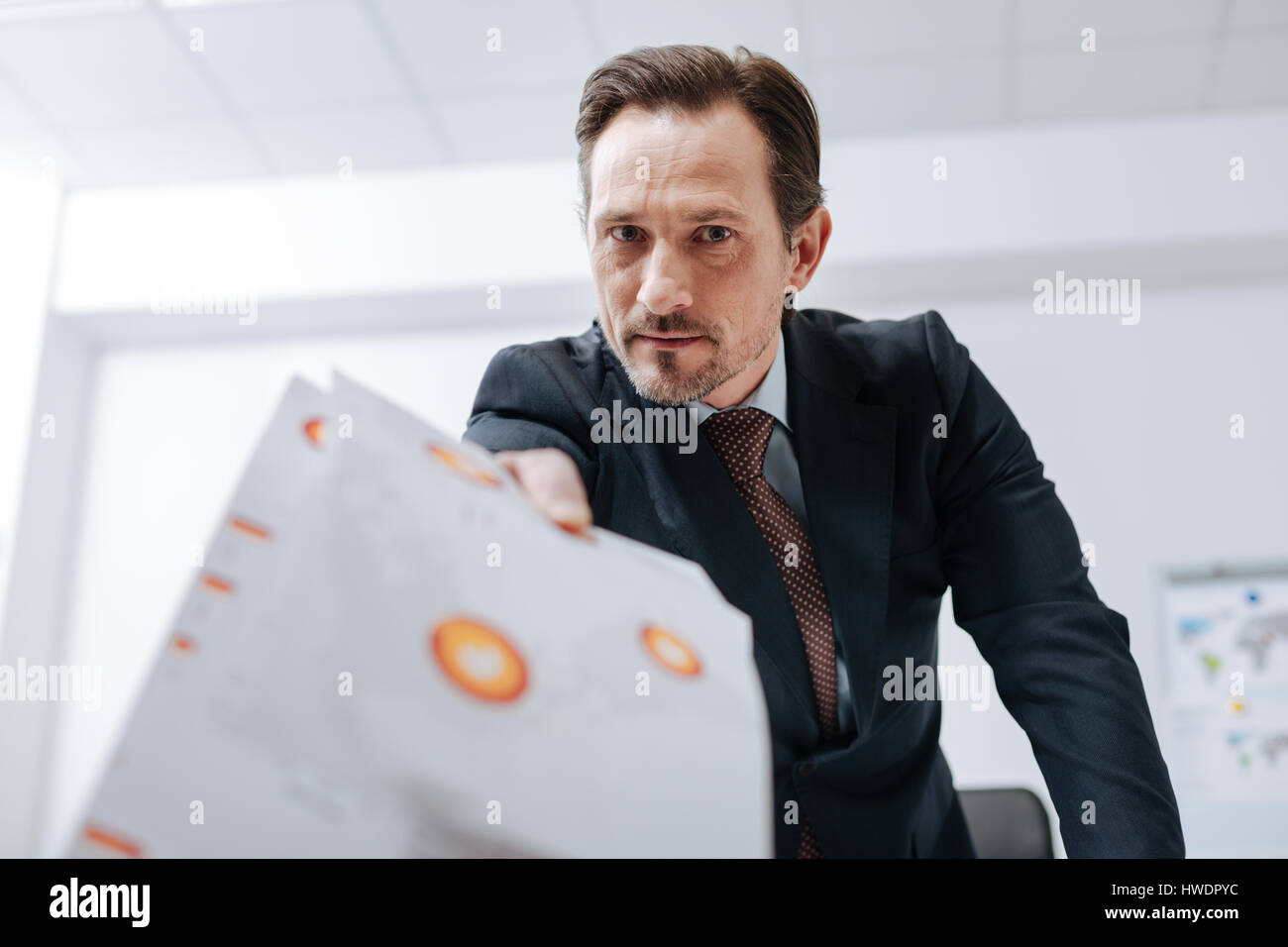 Demanding boss throwing paper in the office Stock Photo - Alamy