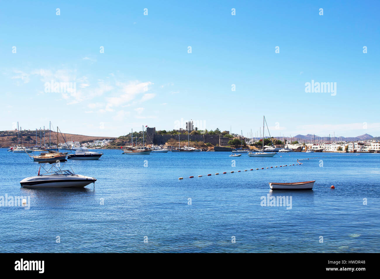 Luxury yachts, sailing and fishing boats in Bodrum bay. Famous landmark ...