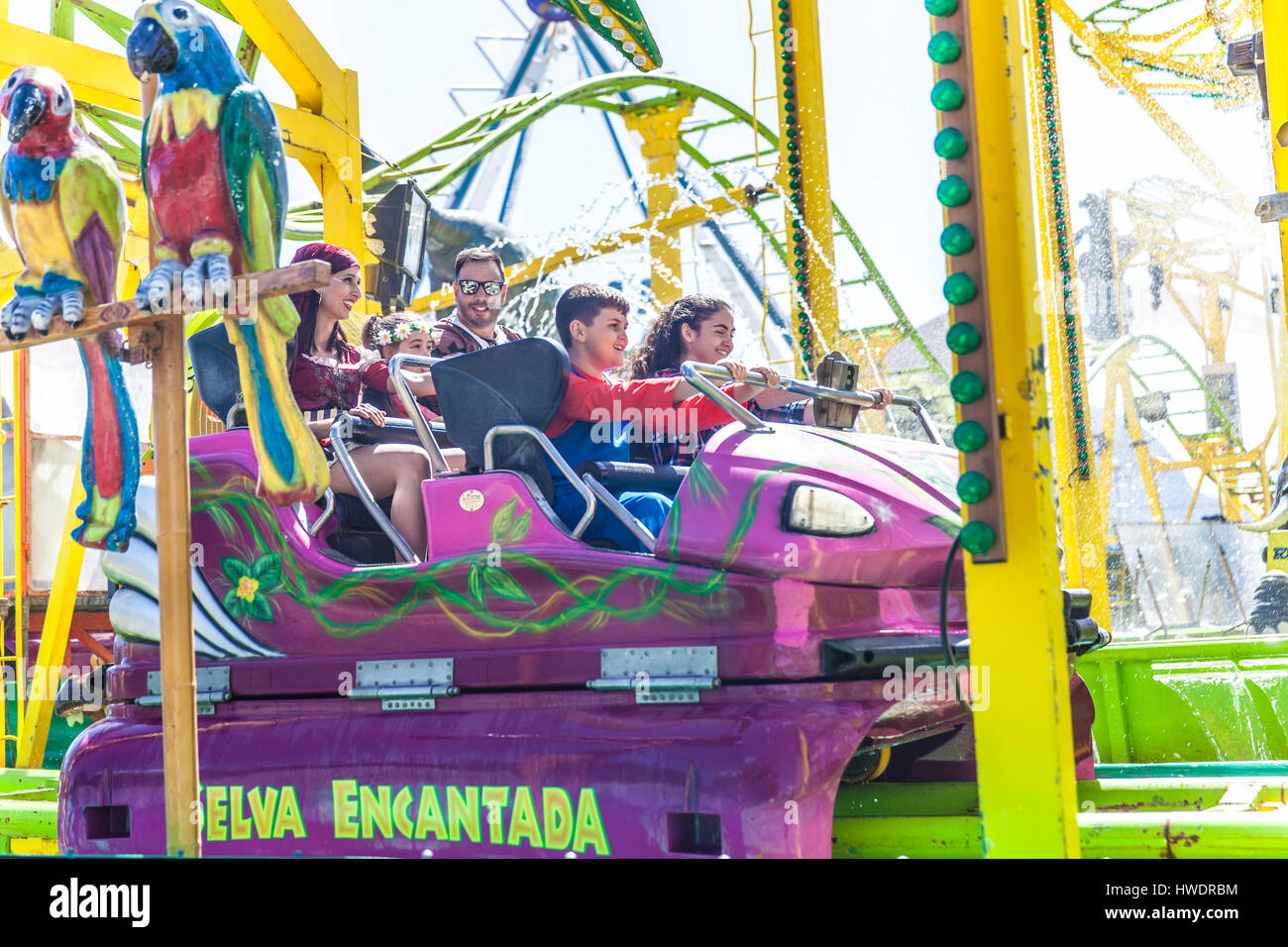 family having fun in a roller coaster Stock Photo - Alamy