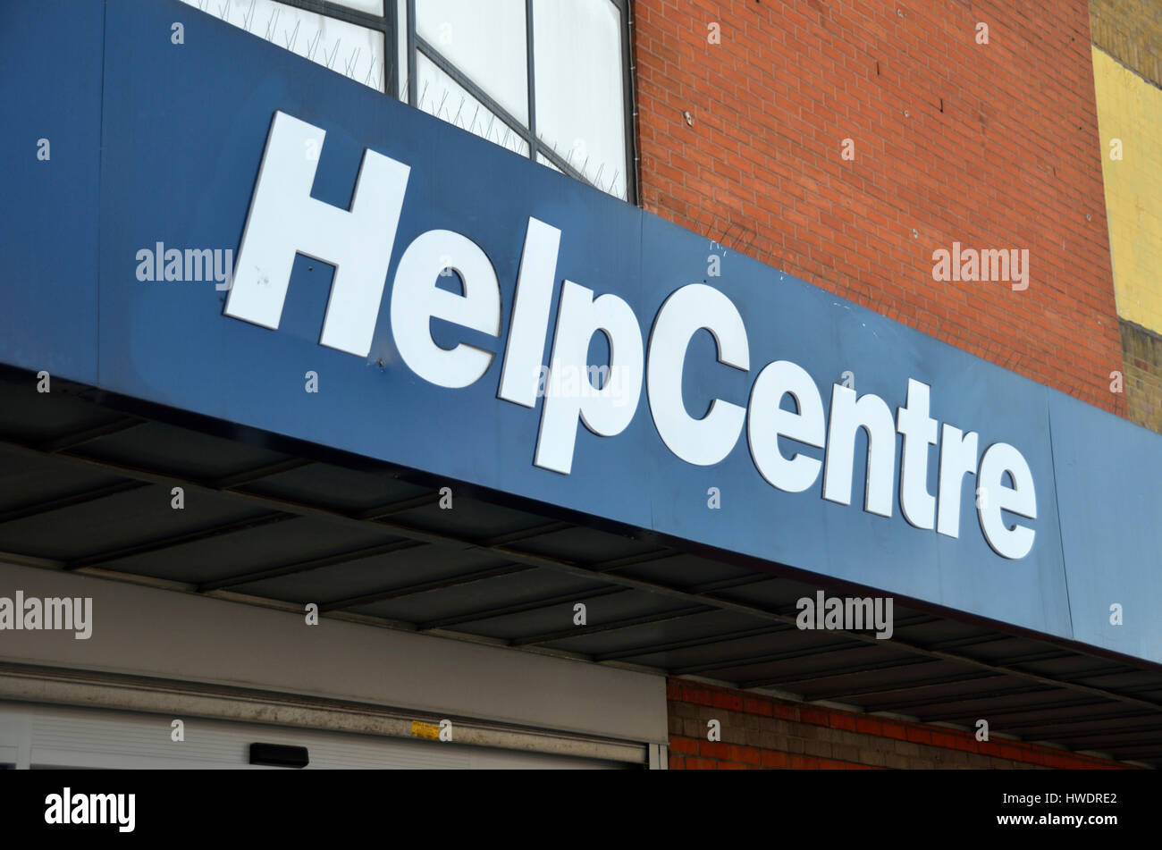 Large ’Help Centre’ sign outside a building Stock Photo - Alamy