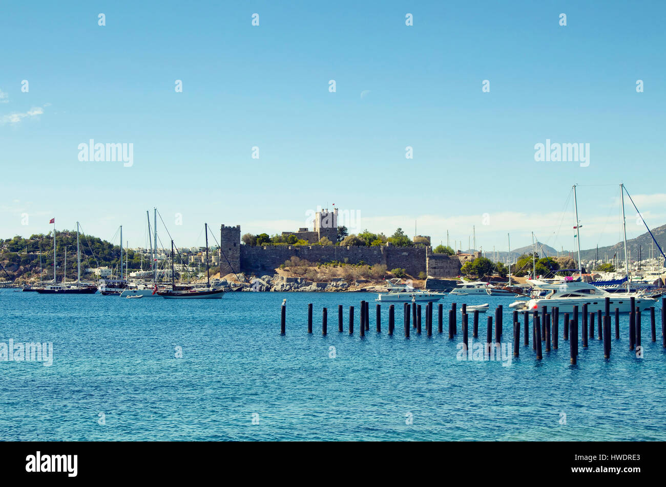 Luxury yachts, sailing and fishing boats in Bodrum bay. Famous landmark ...