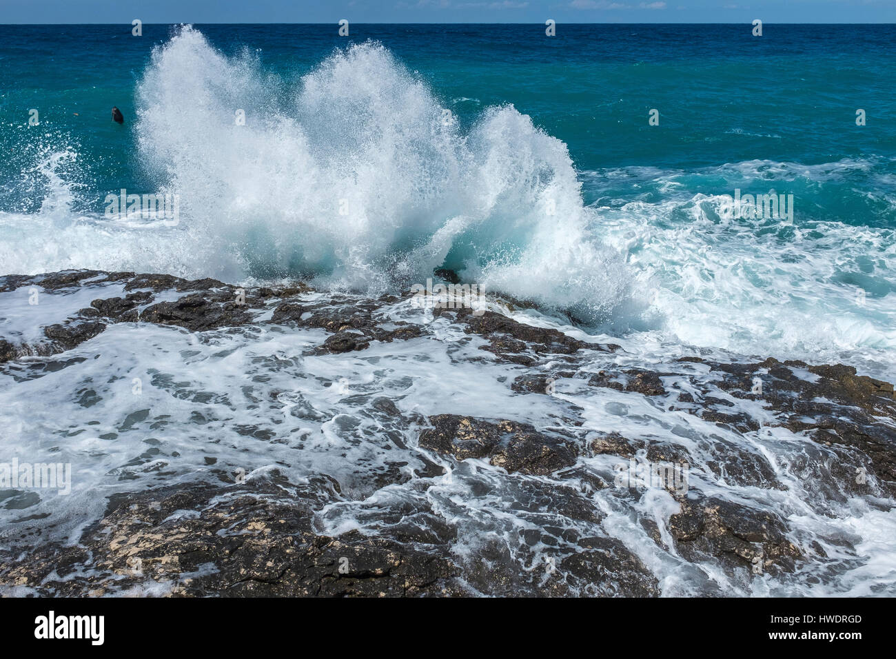 big wave splash on stone Stock Photo - Alamy