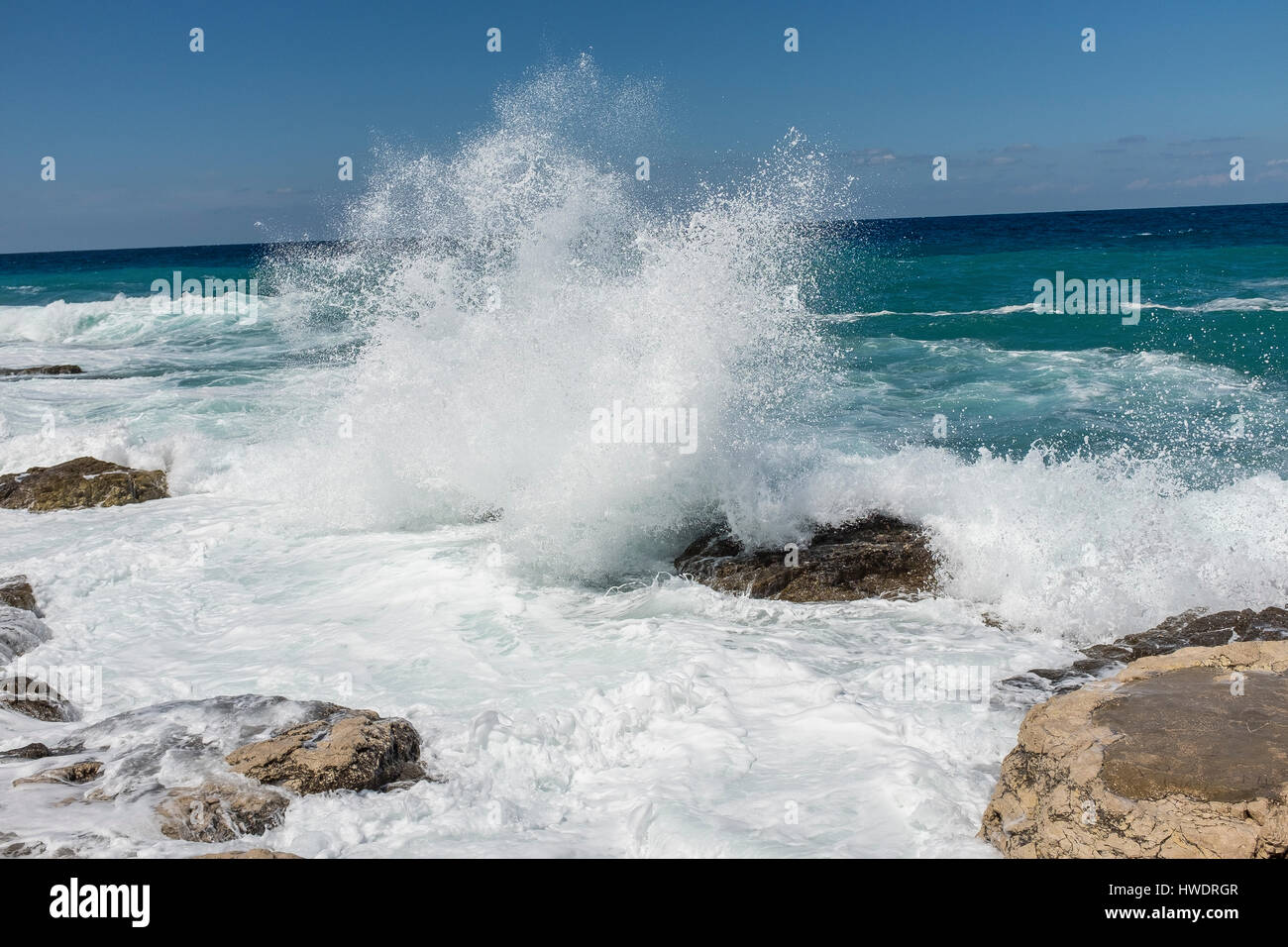 big wave splash on stone Stock Photo - Alamy