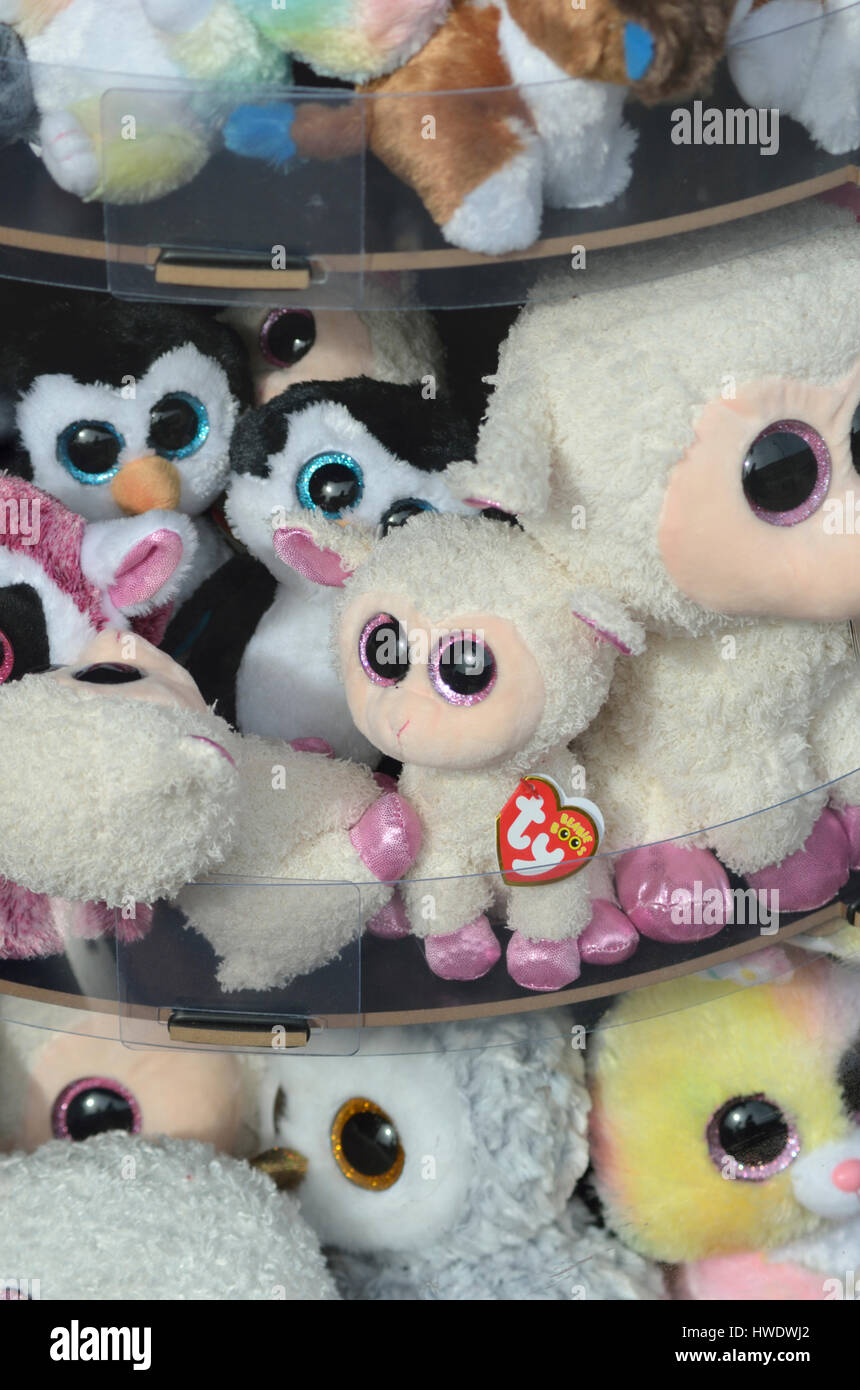 Cuddly toys in a shop window display Stock Photo - Alamy