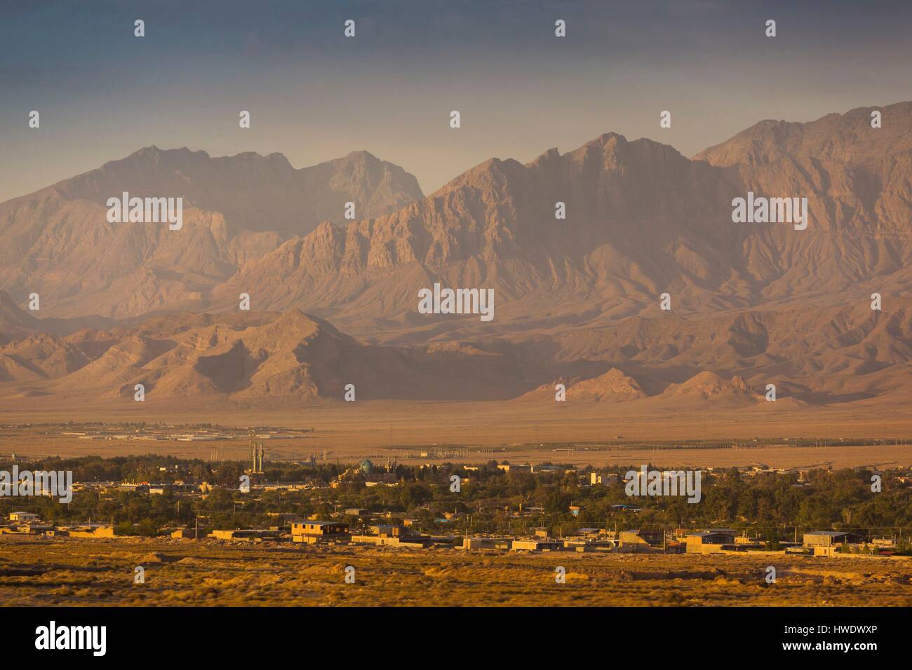 Iran, Southeastern Iran, Mahan, mountains and elevated town view Stock ...