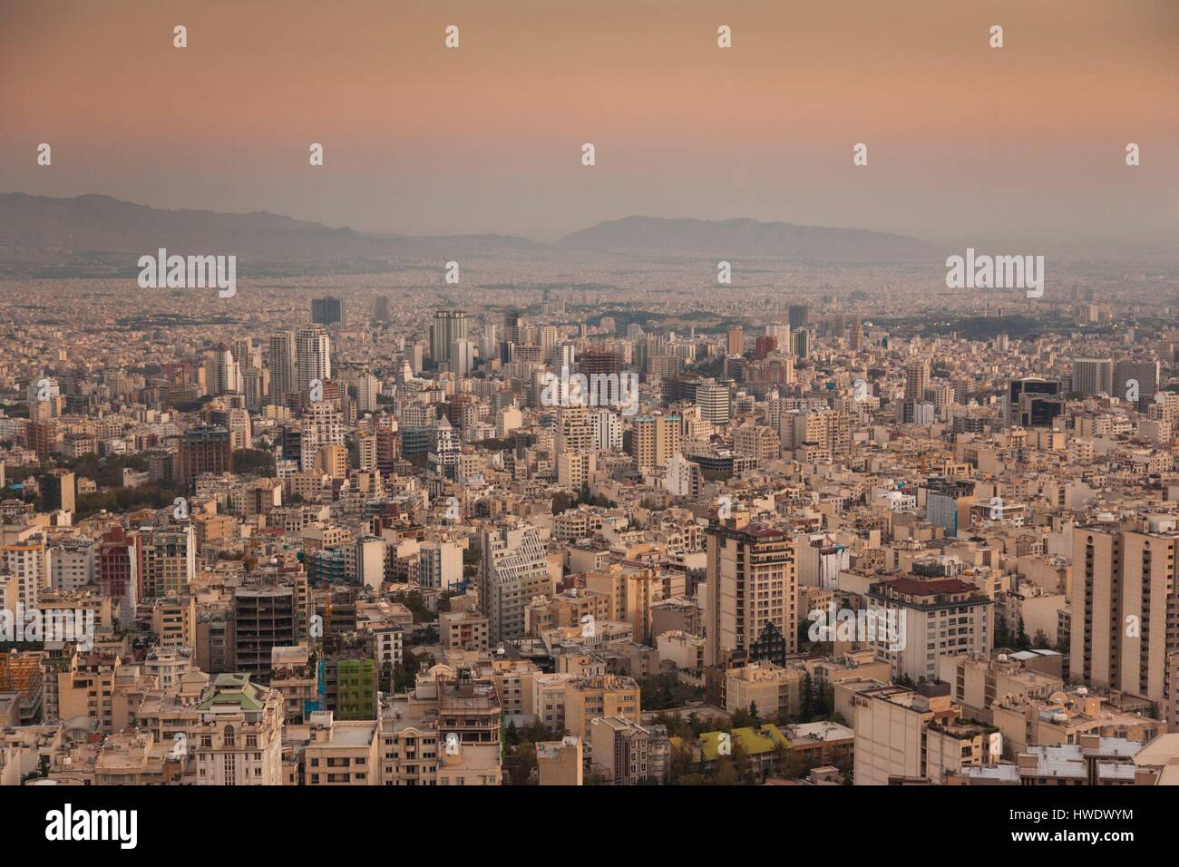 Iran, Tehran, elevated city skyline from the Roof of Iran Park, dusk ...