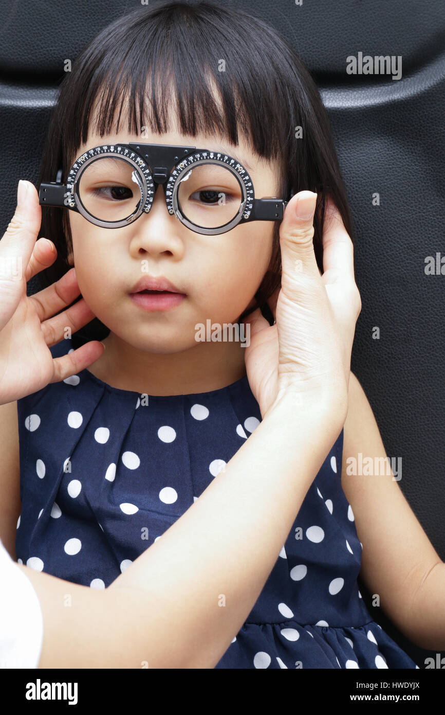 Asian Little Chinese Girl Doing Eyes Examination at An Optical Shop ...
