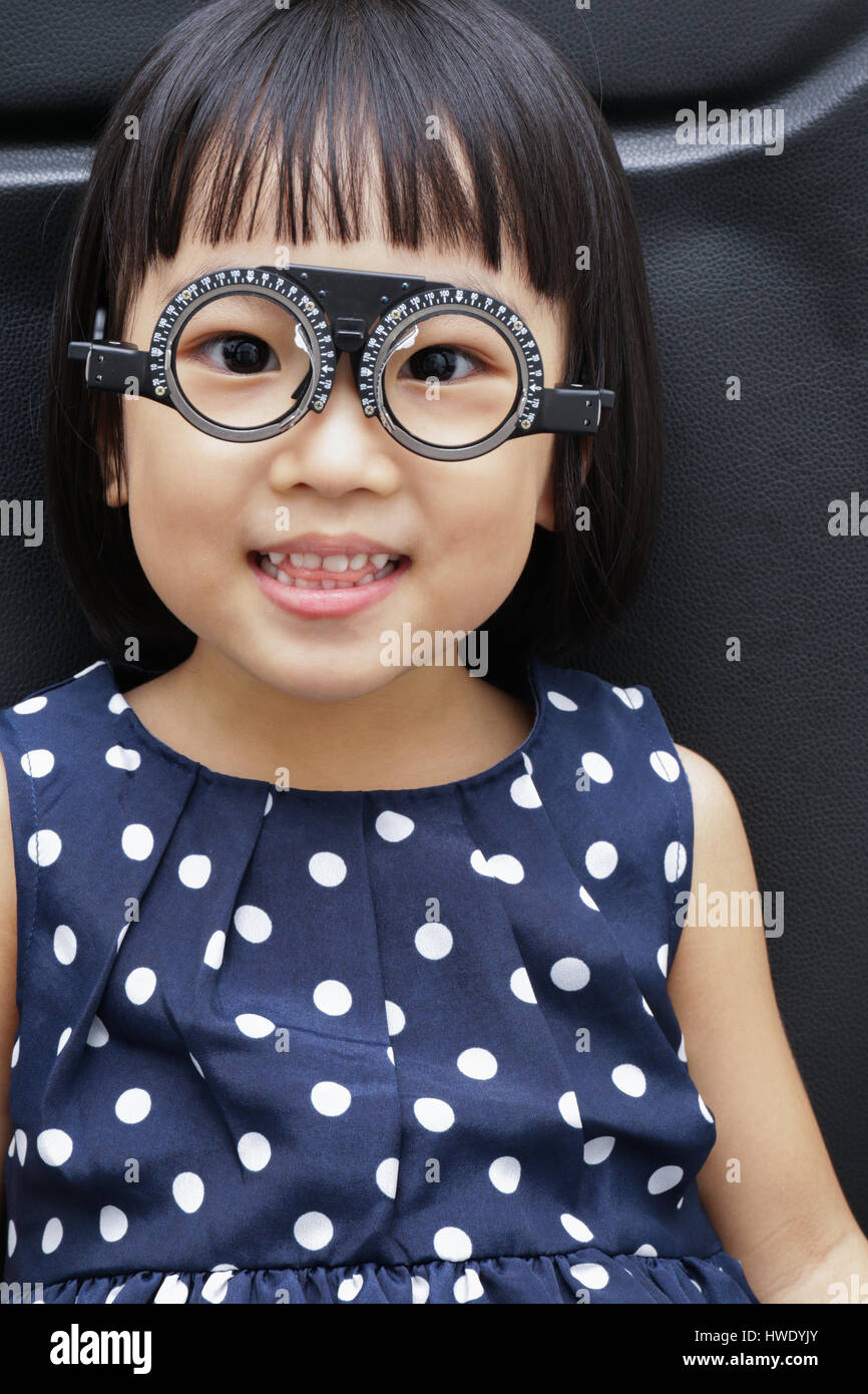 Asian Little Chinese Girl Doing Eyes Examination at An Optical Shop ...