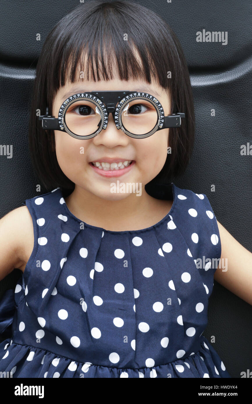 Asian Little Chinese Girl Doing Eyes Examination at An Optical Shop ...