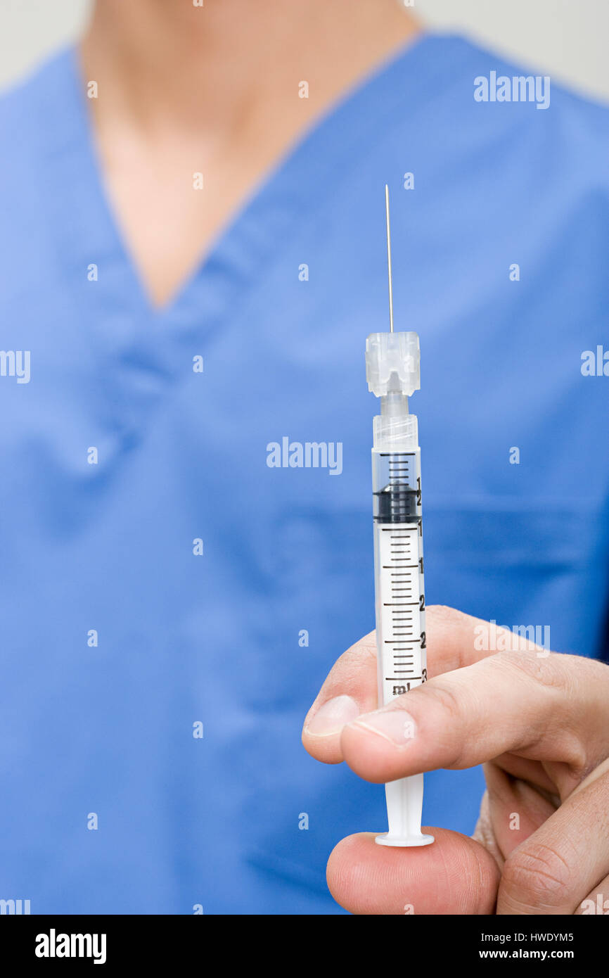 Doctor with syringe Stock Photo - Alamy