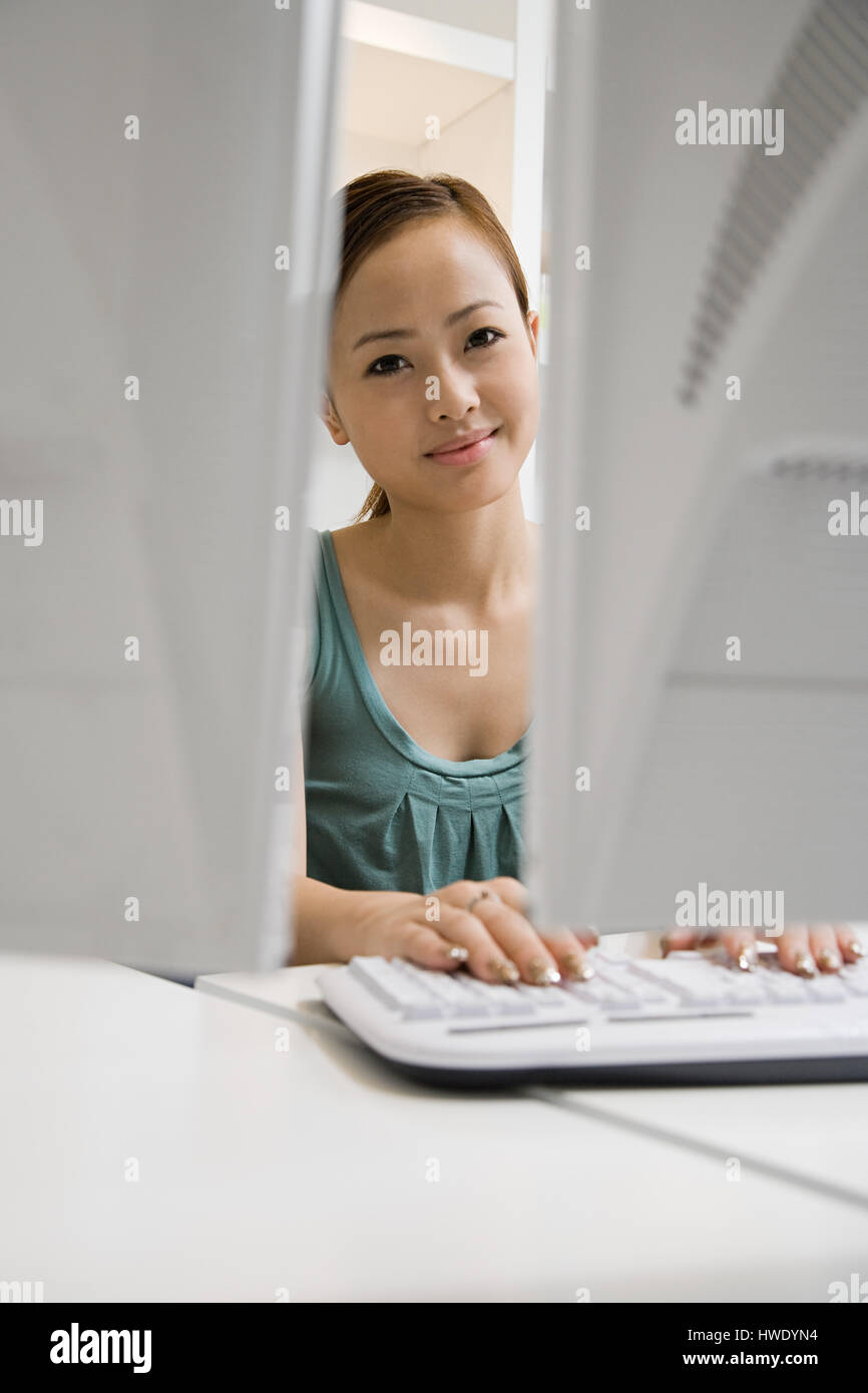 Woman working on computer Stock Photo - Alamy