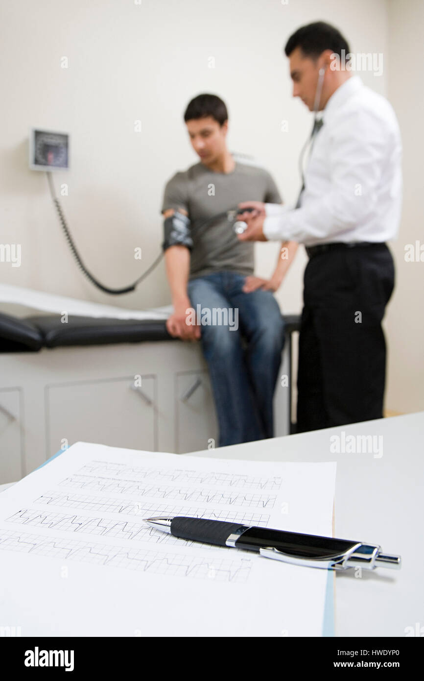 Doctor examining patient Stock Photo - Alamy